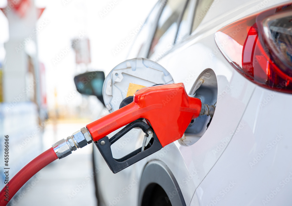 Refill and filling Oil Gas Fuel at station. Gas station - refueling. To ...