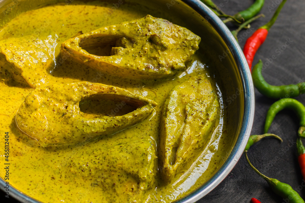 Sorshe Illish or Hilsa fish cooking with mustard seed.famous Bengali ...