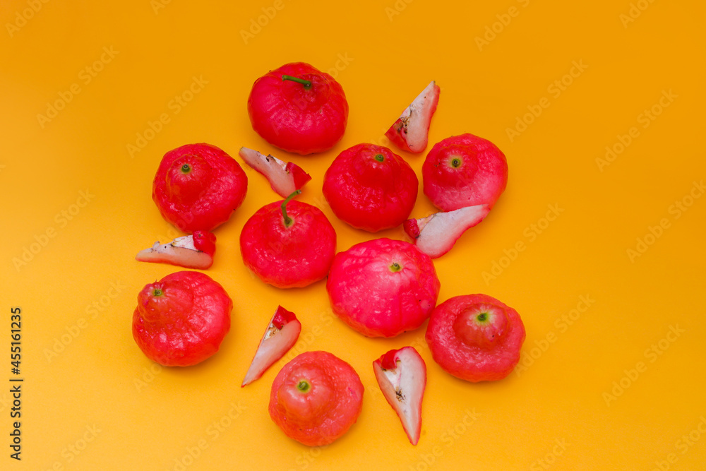 Freshly rose apple fruit isolated on orange background. Also known as ...