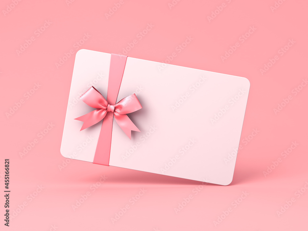 White gift card with pink ribbon bow isolated on pink pastel color ...