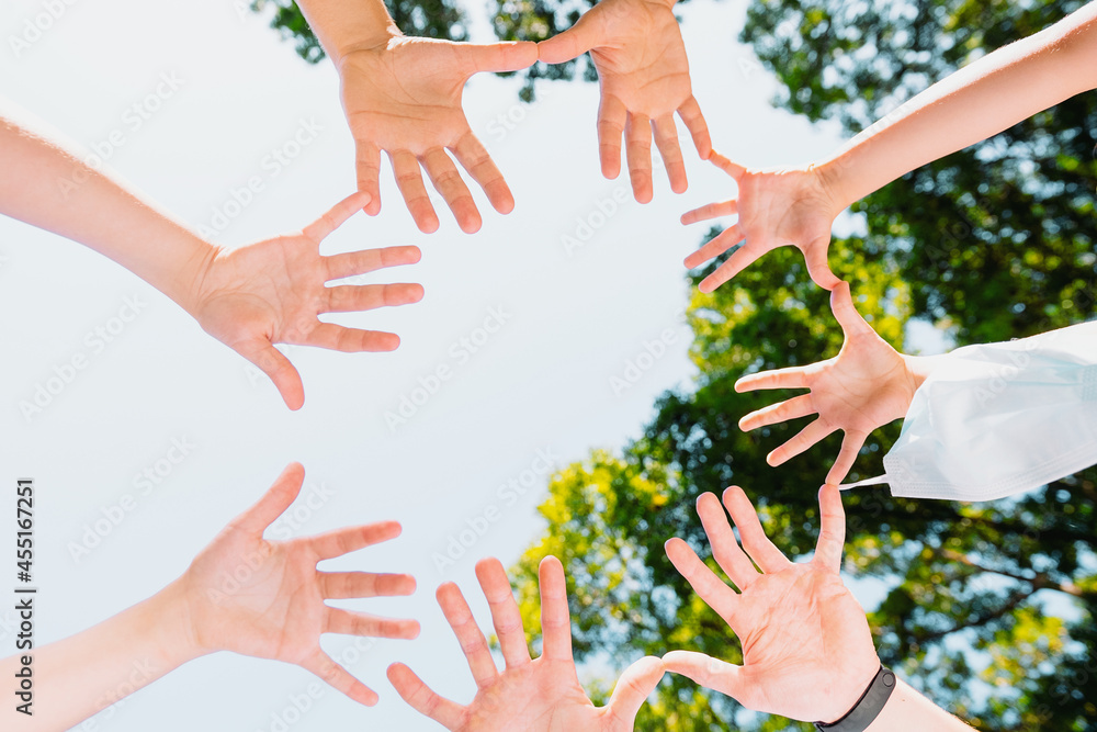 Picture from above of the people hands turned with their palms in the ...