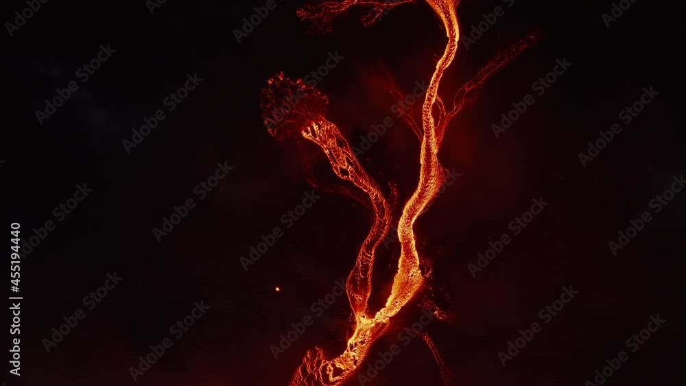 Aerial birds eye overhead top down panning view of flowing hot lava ...