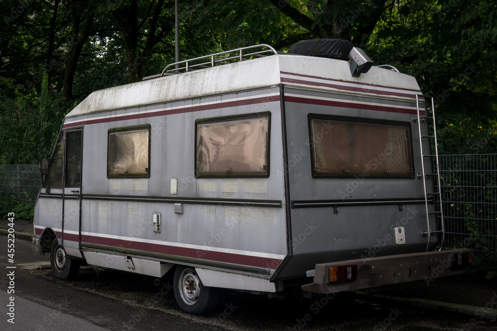 old vintage camper van parked on the street from behind Stock Photo ...