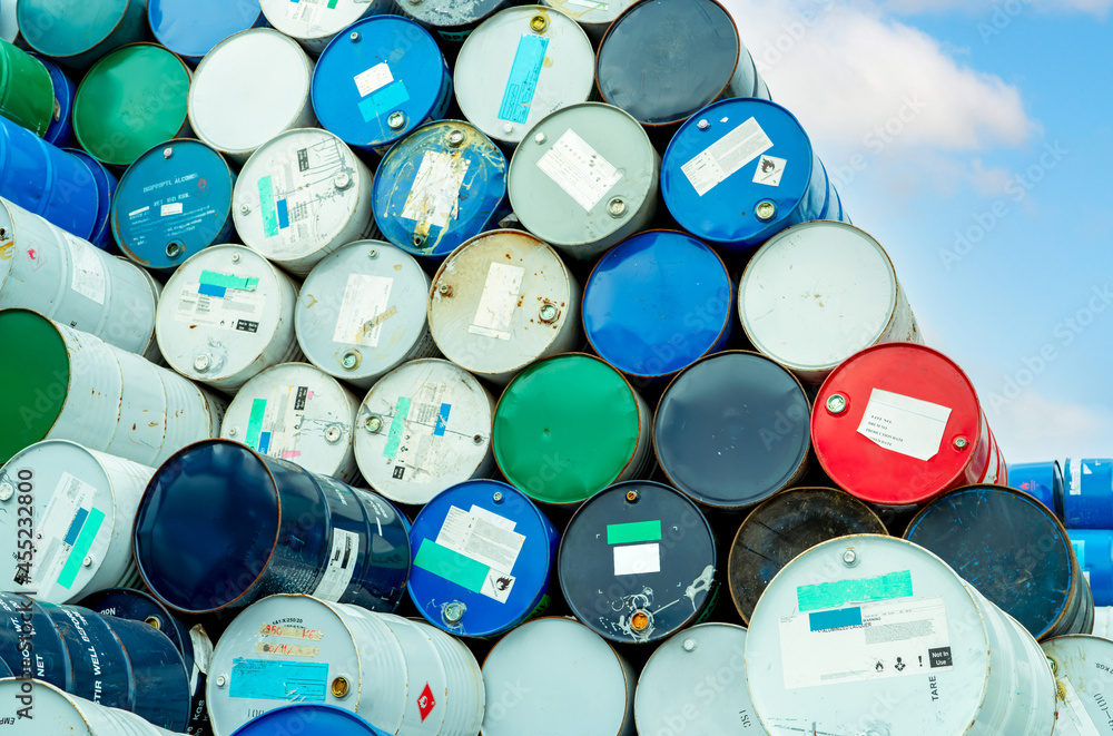 Old chemical barrels with flammable liquid warning label . Steel oil ...