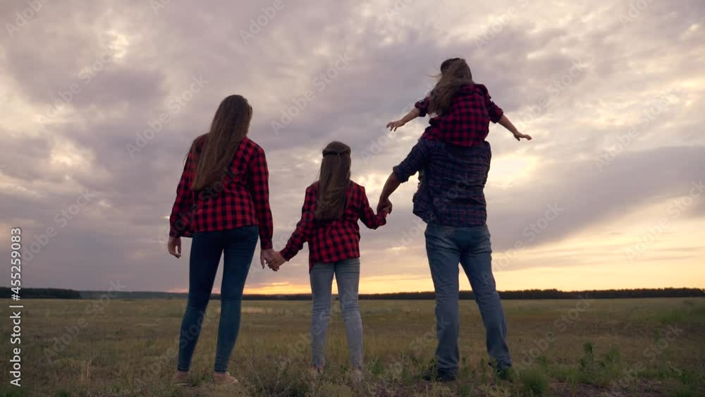 teamwork. Happy family, mother, father, kids in team are walking in ...