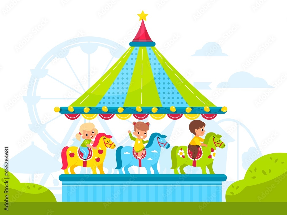 Kids on round carousel with horses. Children ride merry-go-round in ...