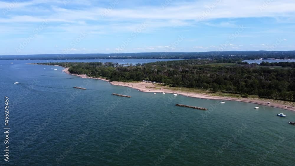 Presque Isle State Park is a 3,200-acre sandy peninsula that arches ...