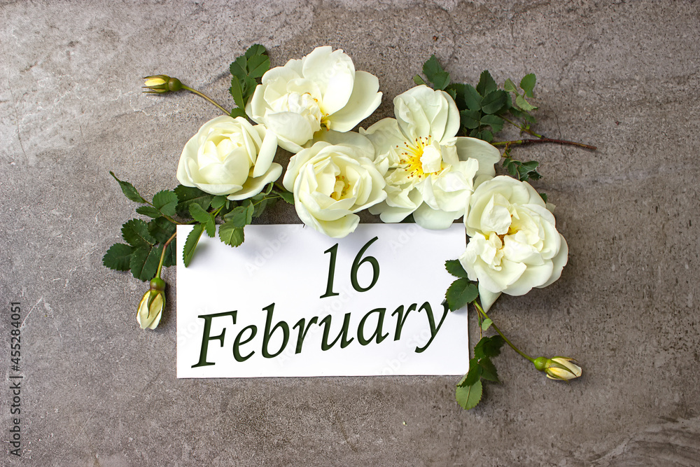 February 16th. Day 16 of month, Calendar date. White roses border on ...