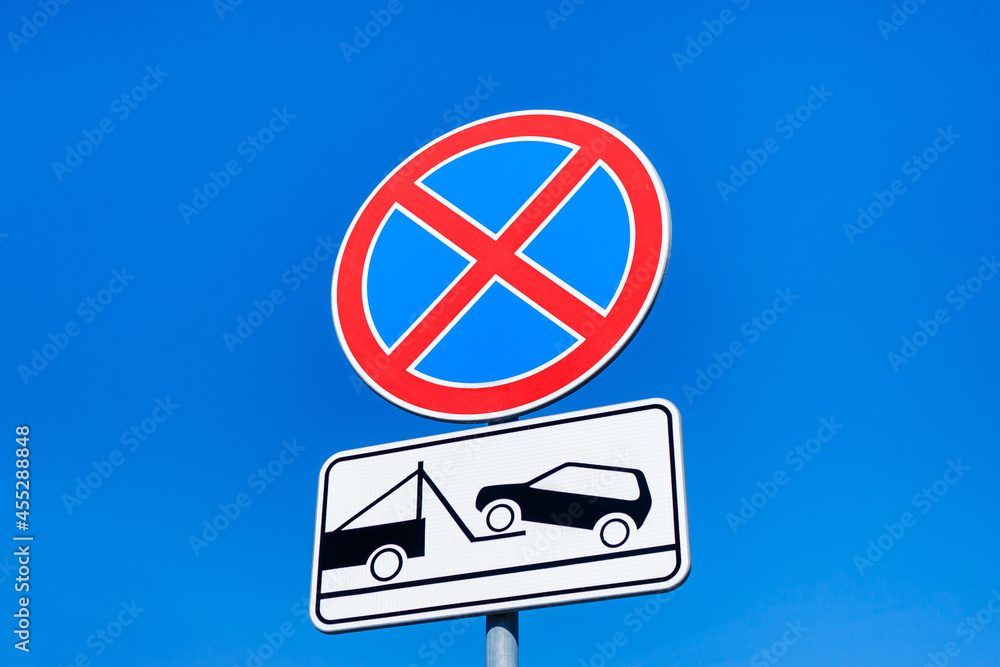 Combination of road signs 'No stopping' or 'No parking' and "Car ...