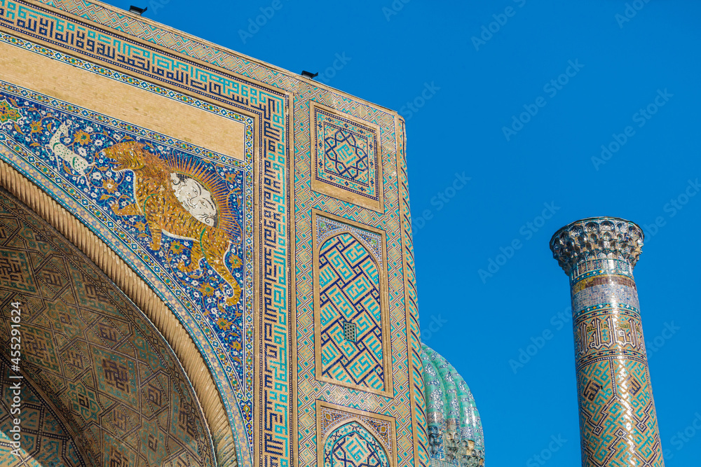 Details of madrasah building, including minaret and piece of dome. Sun ...