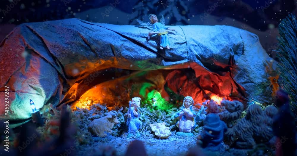 Christmas Nativity Scene with hand-coloured figures and the manger in a ...