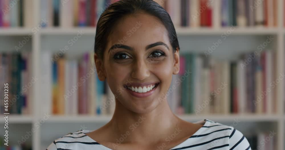 Indian student researcher smiling portrait in library education setting ...