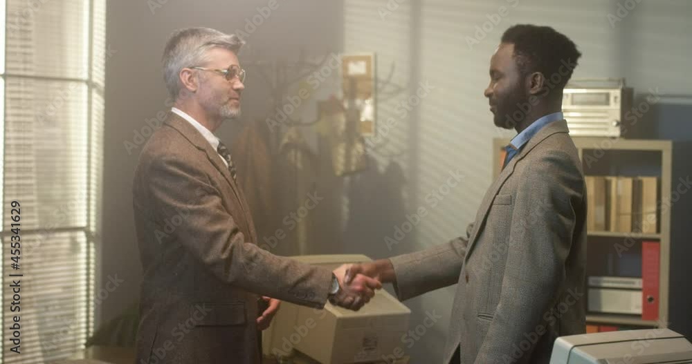 Strong agreement. Waist up of handshake with gratitude. Two diverse men ...