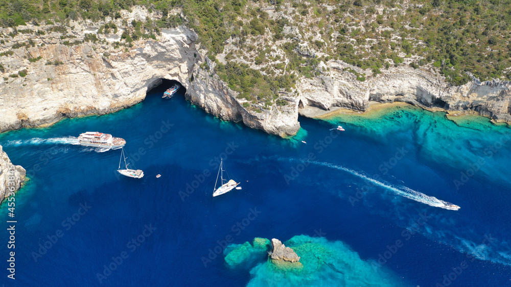 Aerial drone photo of iconic Ortholithos and azure caves with deep ...