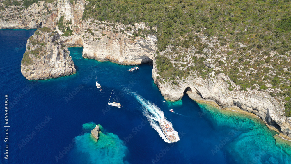 Aerial drone photo of iconic Ortholithos and azure caves with deep ...