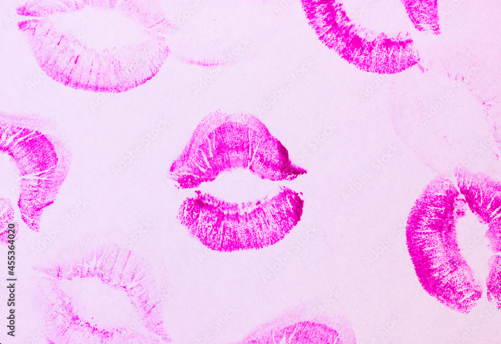 Pink female lip prints on white background. Kisses, smacks, lipstick ...