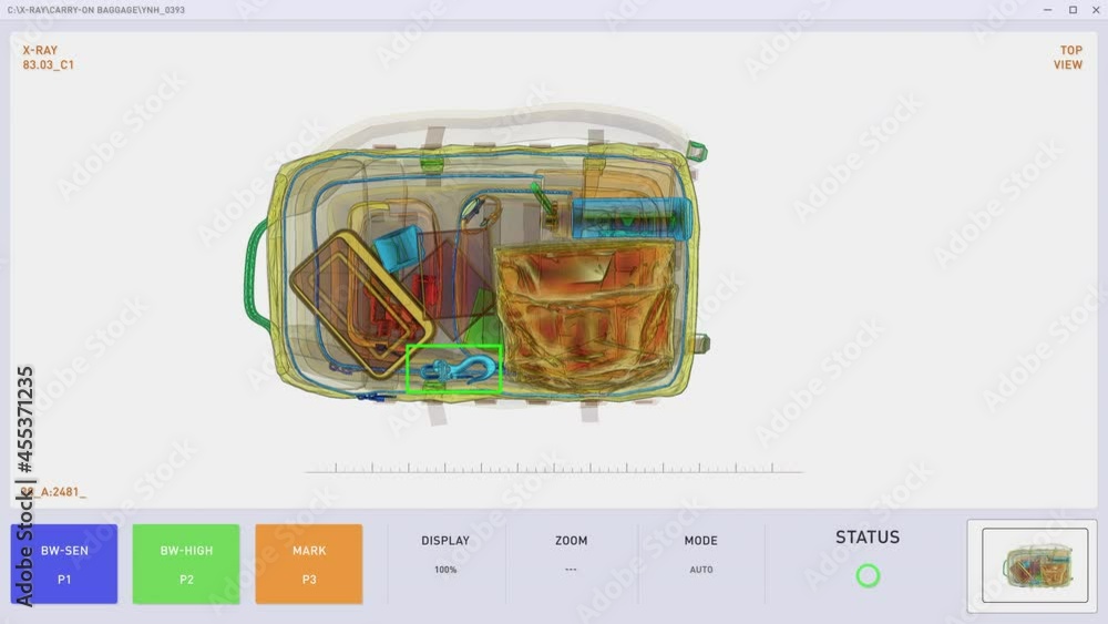 Detection software scanning the luggage on the monitor. Luggage ...