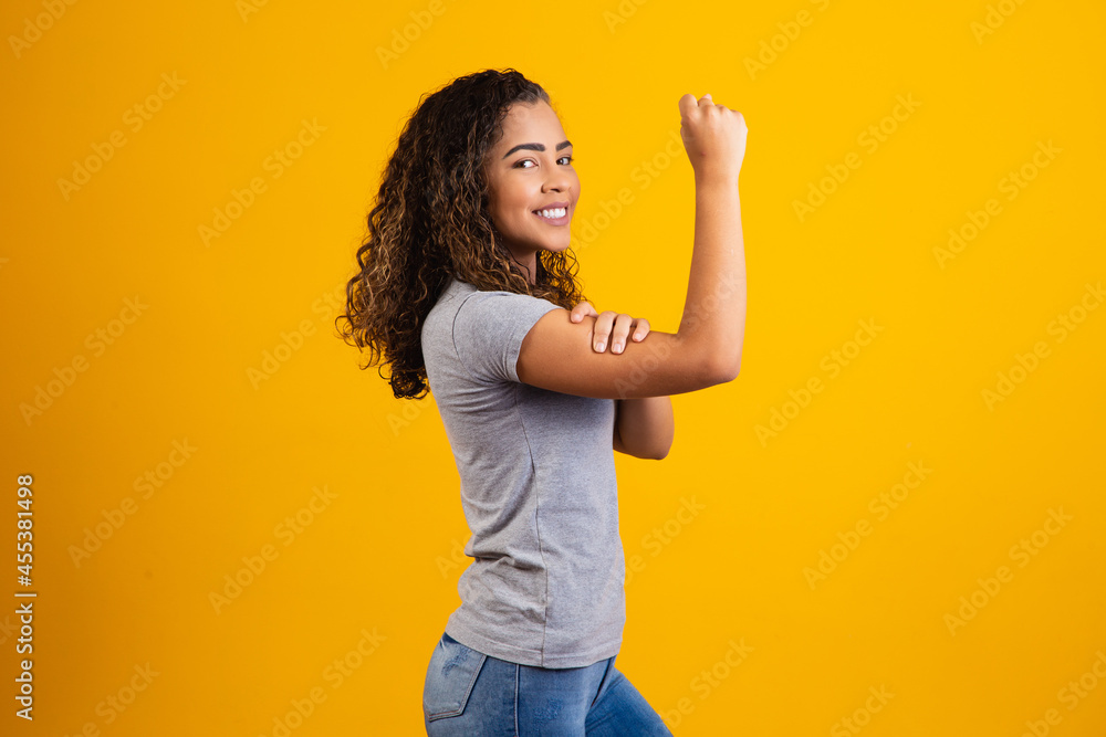 We can do it. Woman's fist of female power. Woman victim of racism ...
