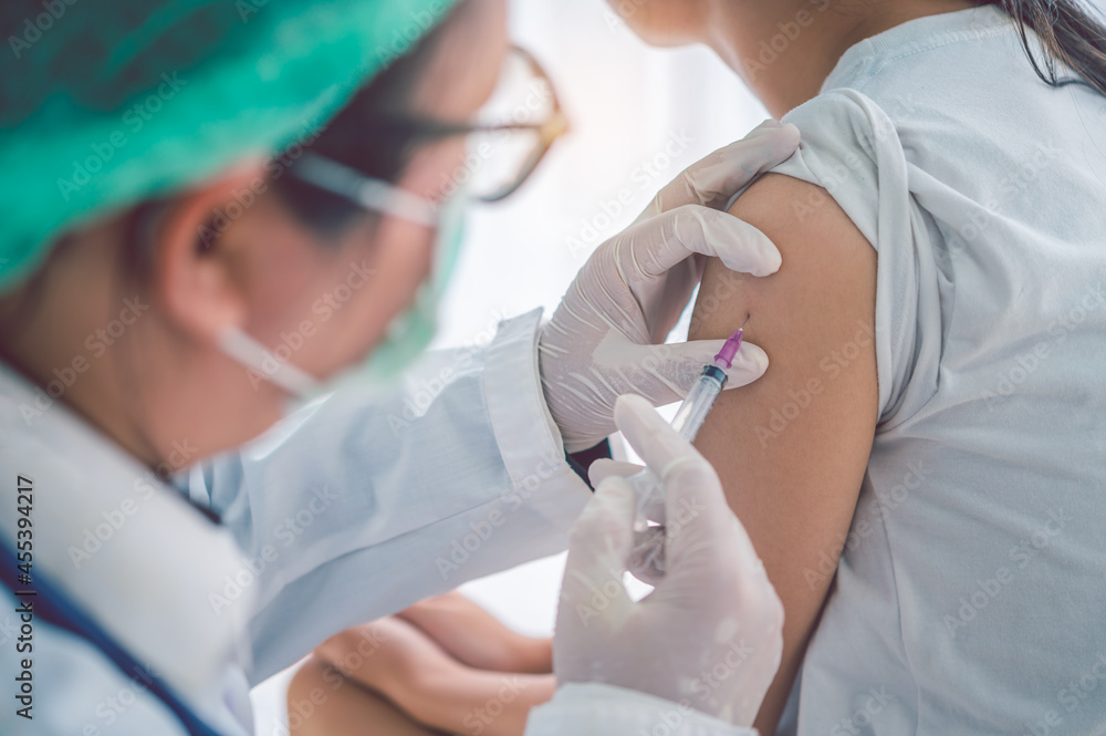 Photo & Art Print The doctor is currently treating patients by injecting arms, photobyphotoboy