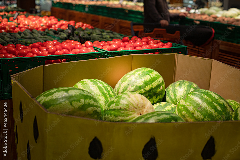 watermelons at the market . Tomatos and watermelons in a supermarket ...
