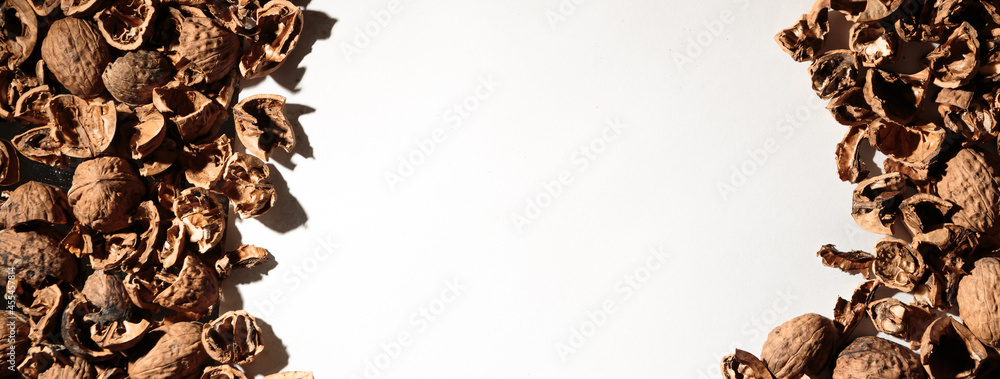 Empty walnut shell frame. Textured nut border with white place ...