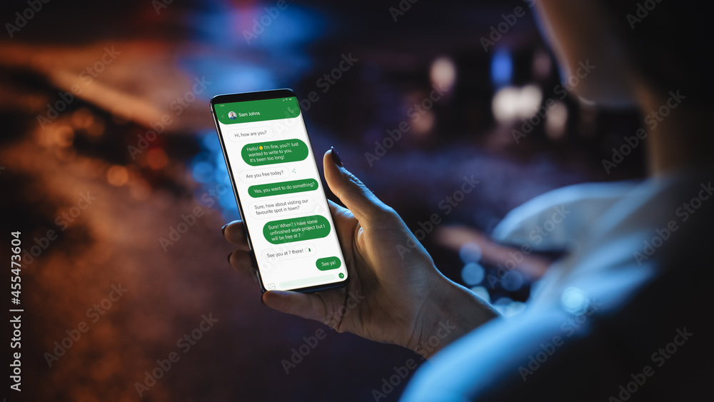 Beautiful Woman is Using Smartphone, Chating and Making an Appointment ...