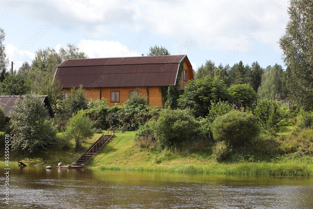 House on the river modern wooden structure with an attic with panorama ...