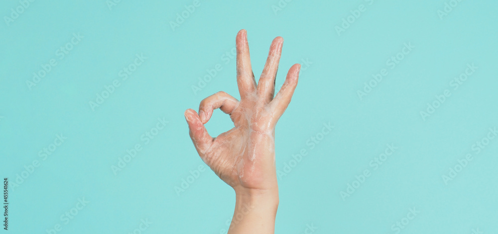 Hand doing okey(ok) hand sign gesture and wash foaming hand soap on ...