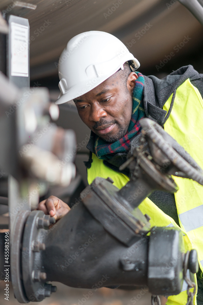 Man wearing safety equipment checking and inspecting gear train Stock ...