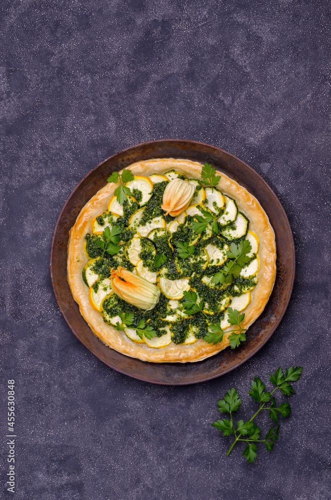 Round vegetable pie with green sauce Stock Photo | Adobe Stock