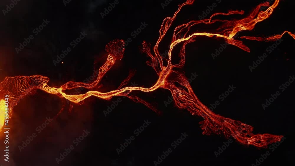 Aerial birds eye overhead top down panning view of flowing hot lava ...