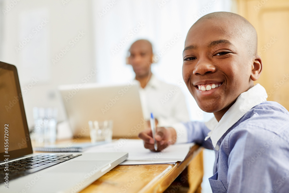 Happy student doing homeschooling homework Stock Photo | Adobe Stock