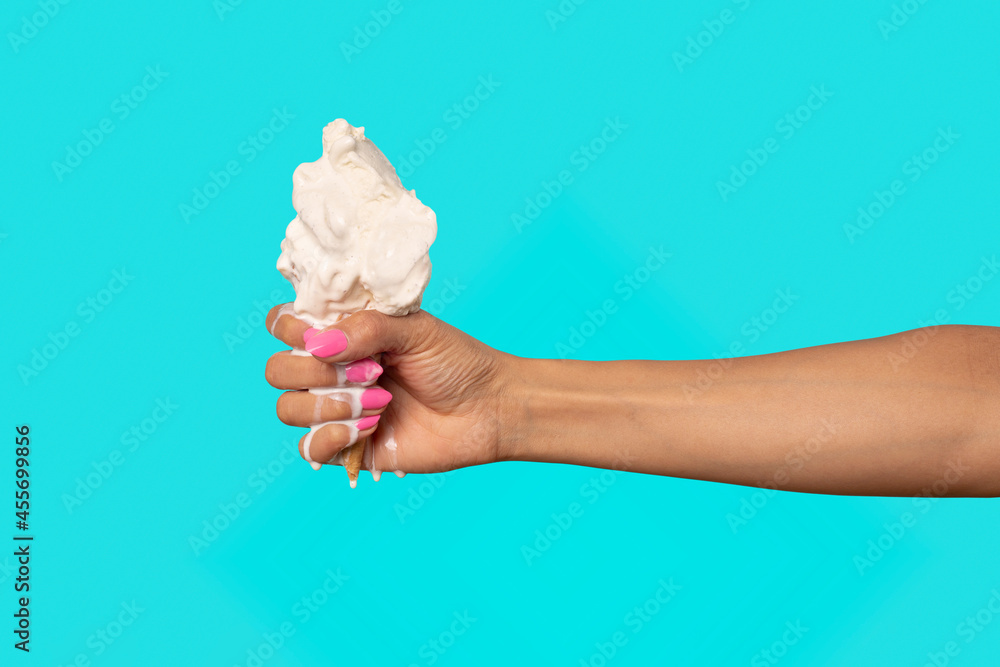Hand holding melting ice cream Stock Photo | Adobe Stock