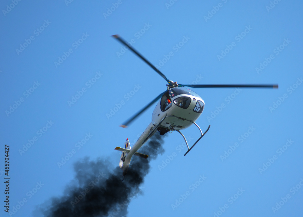 Helicopter with engine problems. Black smoke comes out of the ...