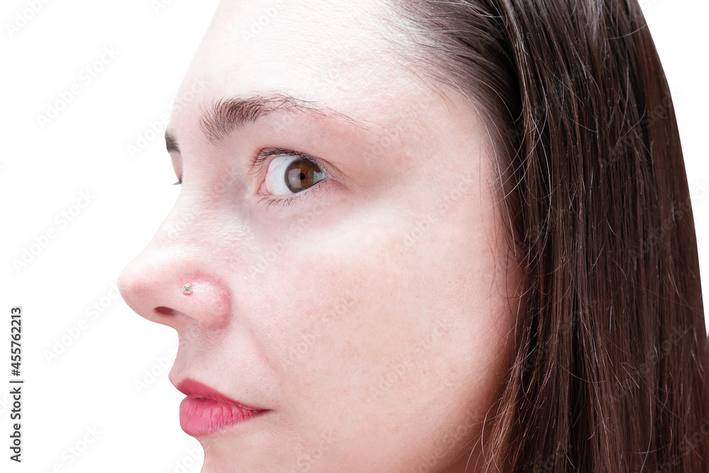 Female face in profile with nose piercing, isolated on white background ...