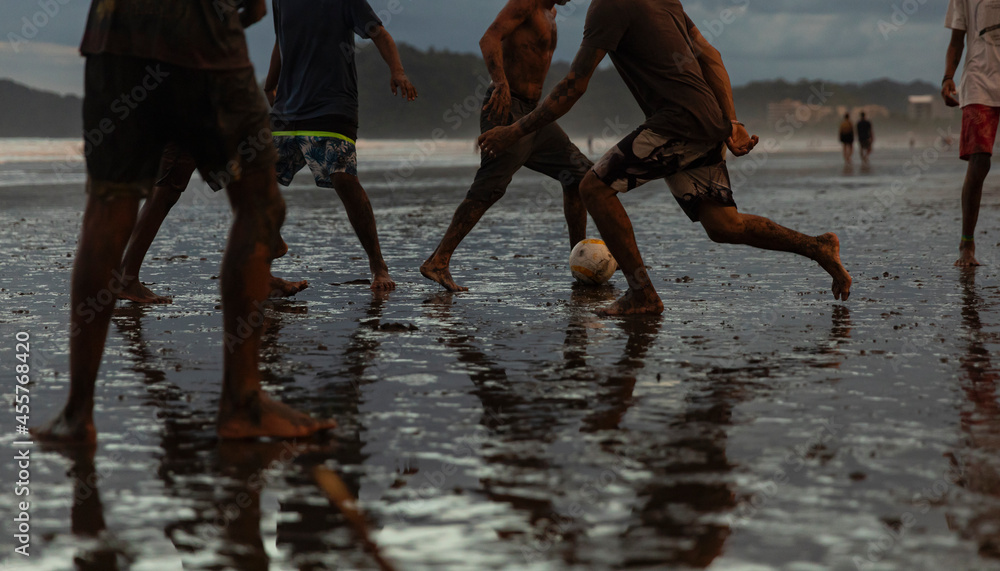 Messy Beach Football Game Stock Photo | Adobe Stock