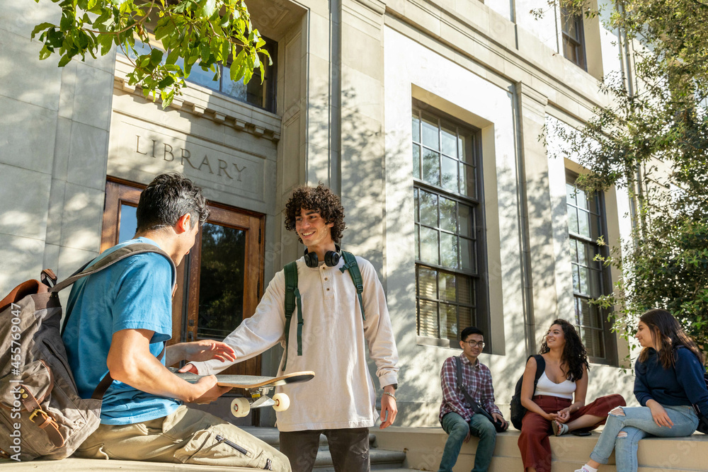 Group of Students Sit on Stairs of Academic Building Stock Photo ...
