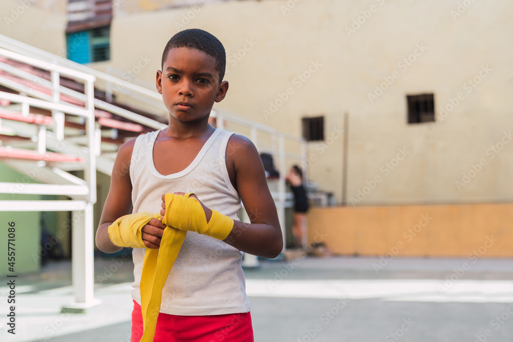 Young kid putting bandages on hands. Stock Photo | Adobe Stock