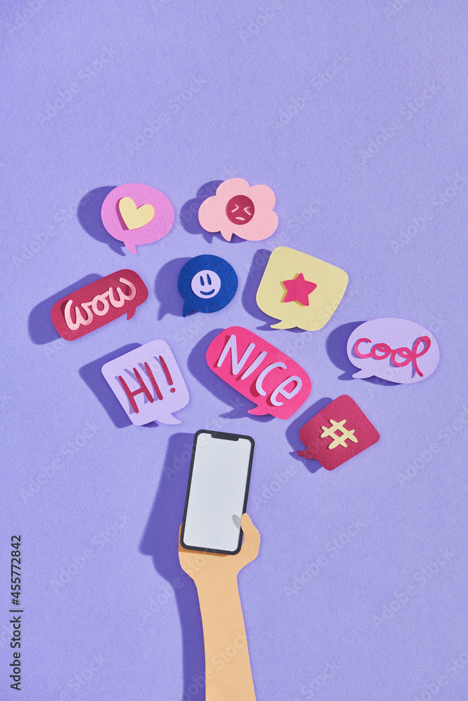 Hand holding phone with short messages. Stock Photo | Adobe Stock