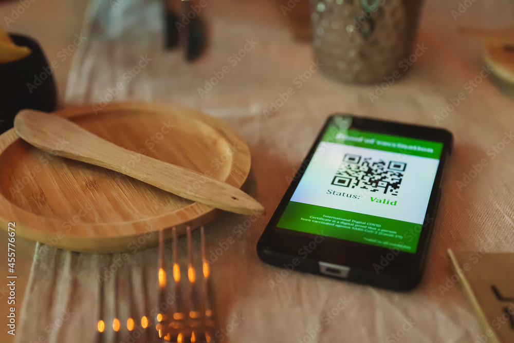 Smartphone app with certificate of immunization in restaurant. Status ...