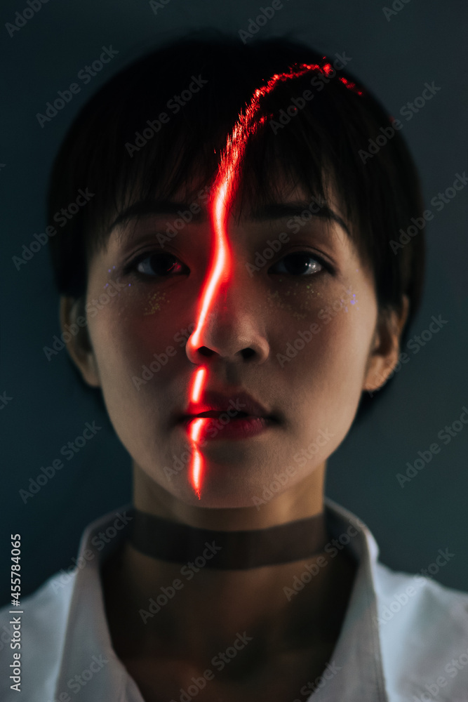 Laser light on woman face Stock Photo | Adobe Stock