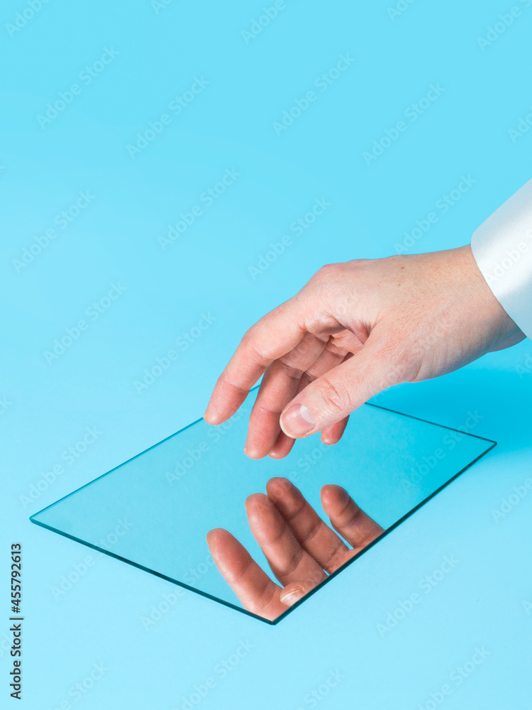 Hand and its reflection in a mirror Stock Photo | Adobe Stock