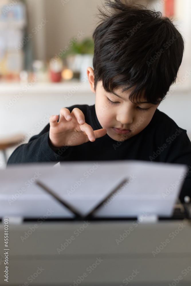 Child using typewriter Stock Photo | Adobe Stock