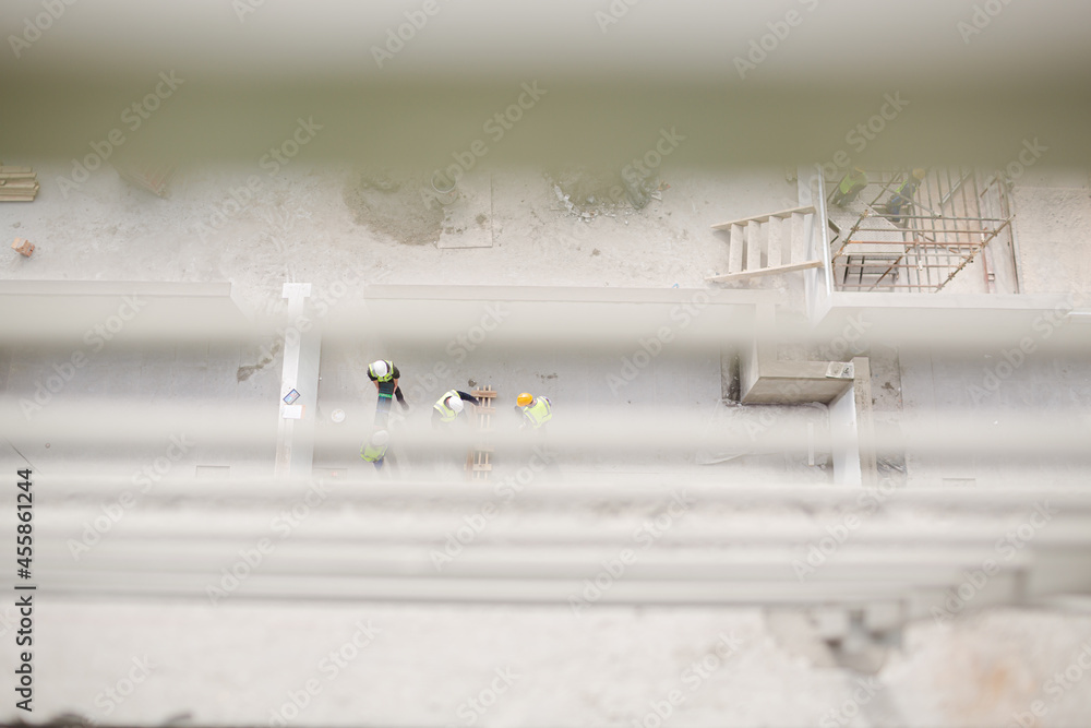 Overhead view of construction workers at construction site Stock Photo ...