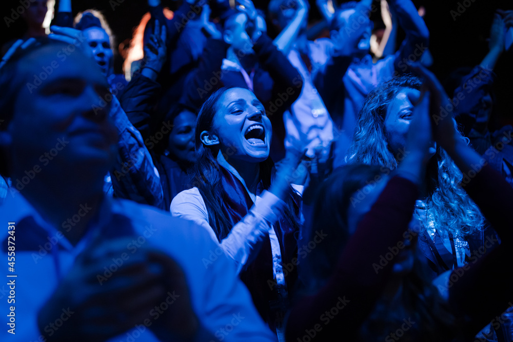 Excited audience clapping in dark room Stock Photo | Adobe Stock