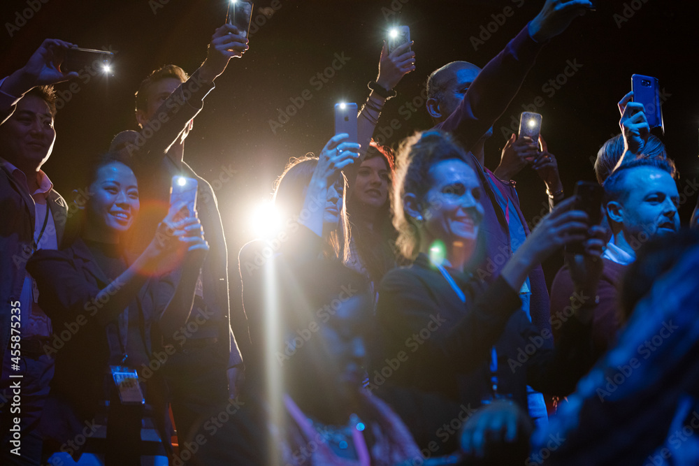 Excited audience with smart phone flashlights cheering Stock Photo ...