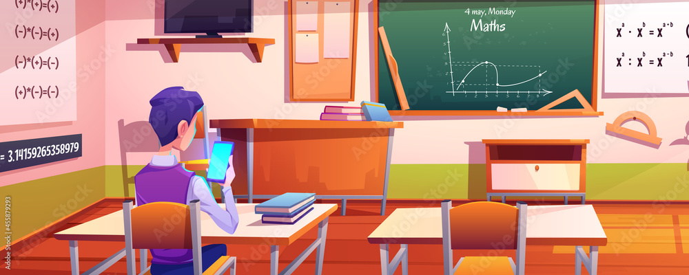 Student or school boy communicate by cell phone sitting at desk in ...