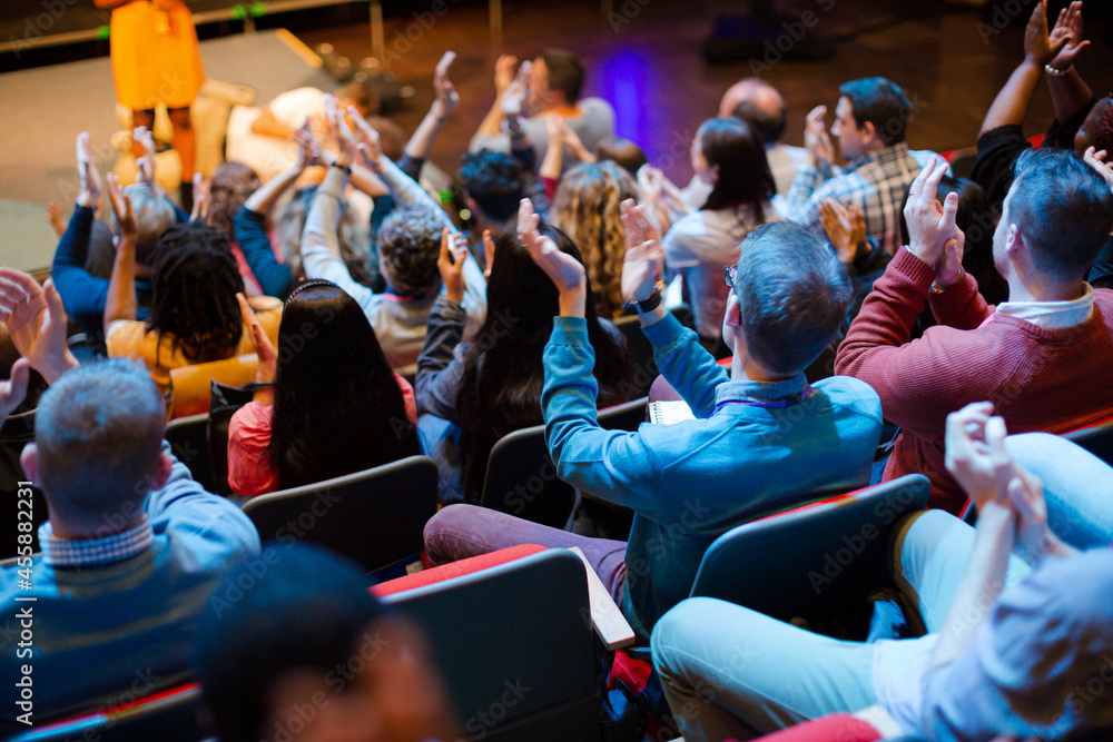 Enthusiastic audience clapping Stock Photo | Adobe Stock