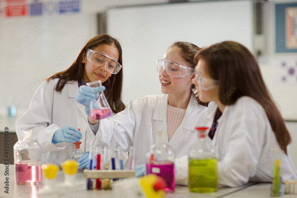 Girl students conducting scientific experiment in laboratory classroom Stock Photo | Adobe Stock