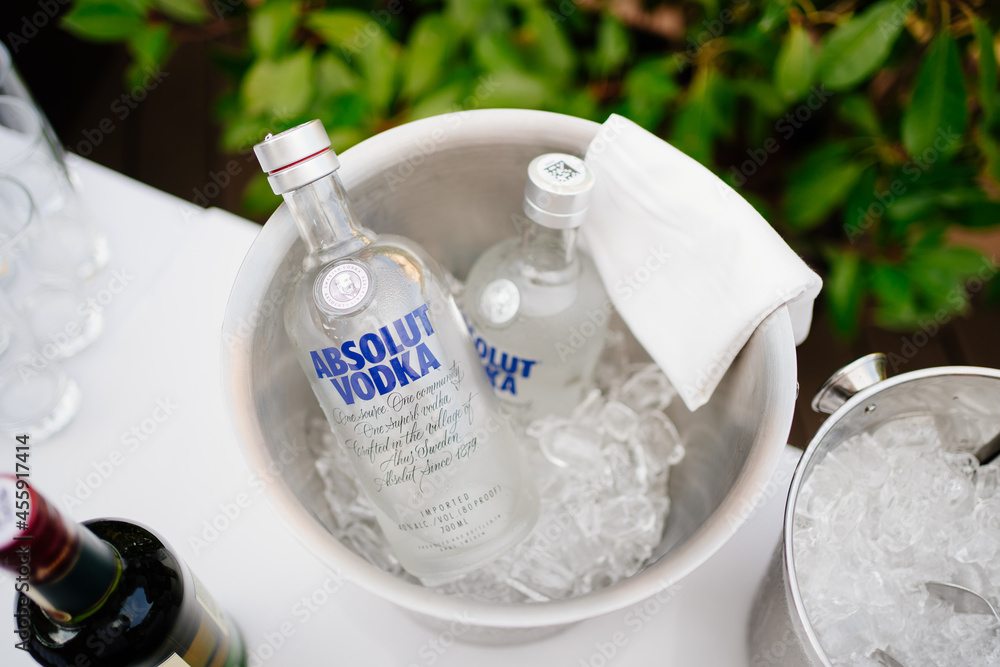vodka brand absolute in a bucket of ice. cooling of alcoholic beverages ...